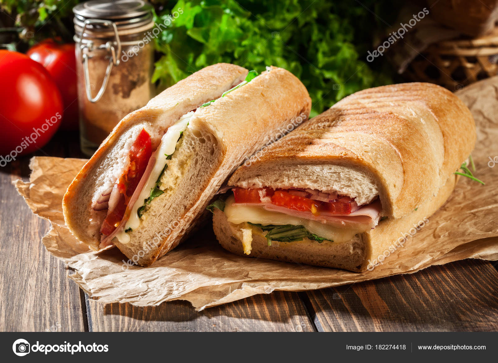 Toasted panini with ham, cheese and arugula sandwich Stock Photo by ...