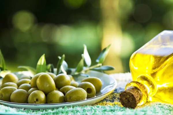 Olive dish and olive oil bottles - Stock Image - Everypixel
