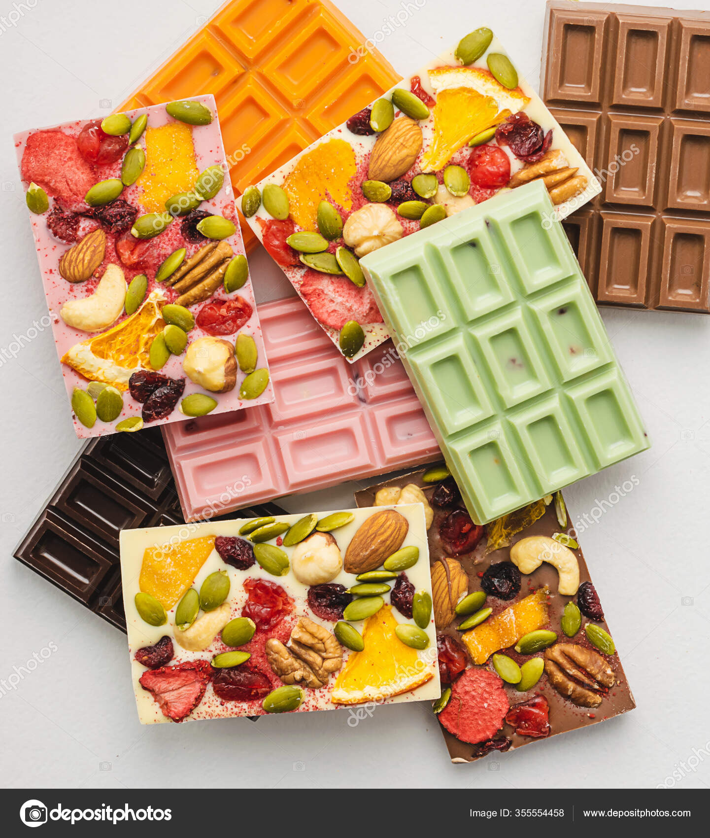 Chocolate of various bright colors and colored fillings with slices ...