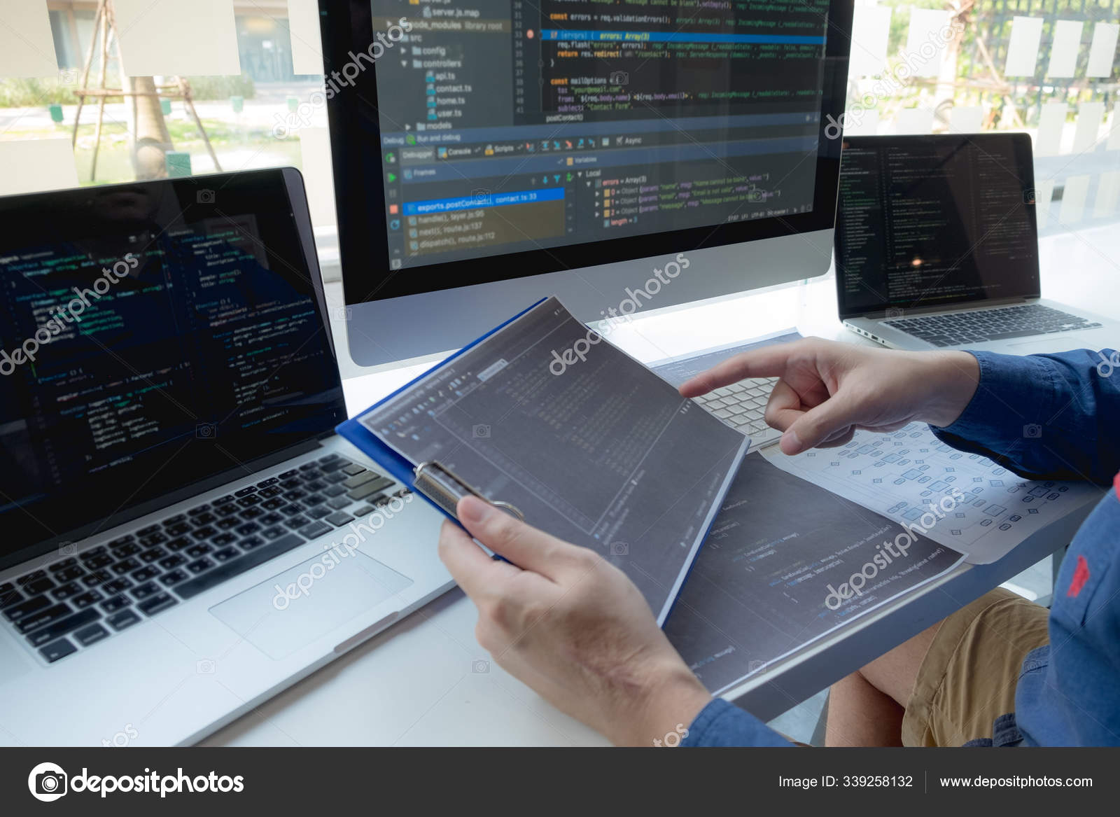 Programmers work on the development of coding and coding technol ...