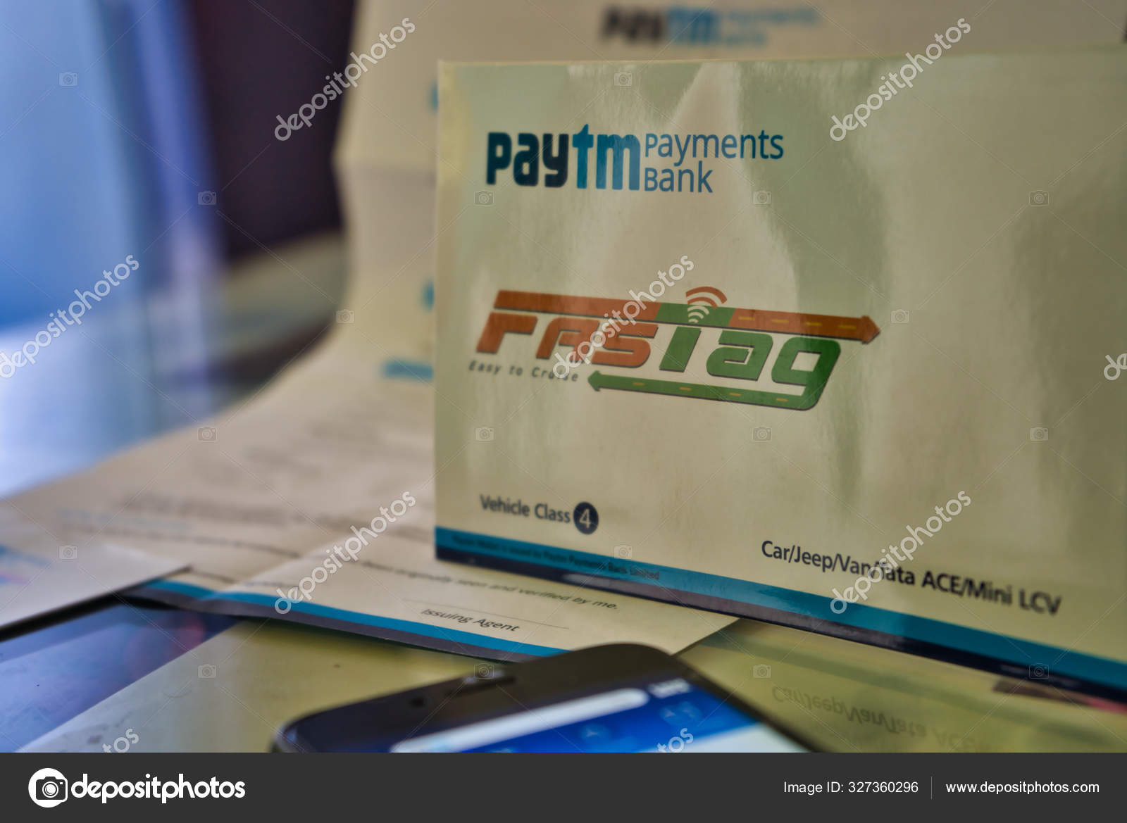 Fast Tag along with a mobile phone on the table, the application form ...