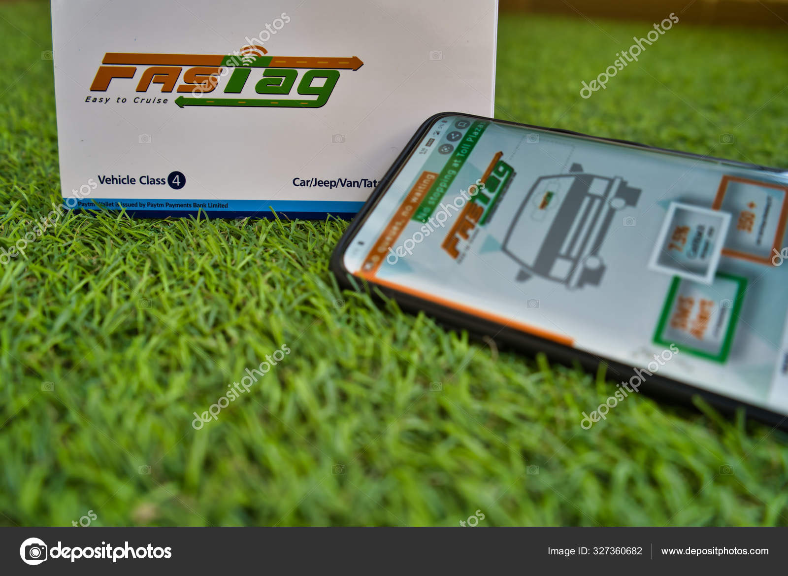 Fast Tag on green grass with a mobile phone logged into fast tag ...