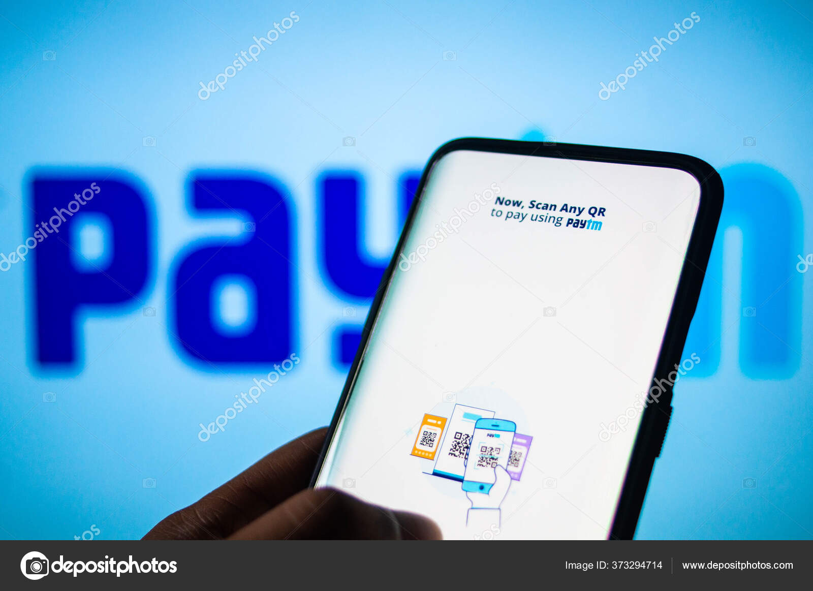 Paytm app logged in on a mobile infront of a white screen with Paytm ...