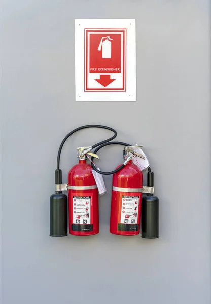 Two fire extinguishers were mounted on the wall for use in the event of ...