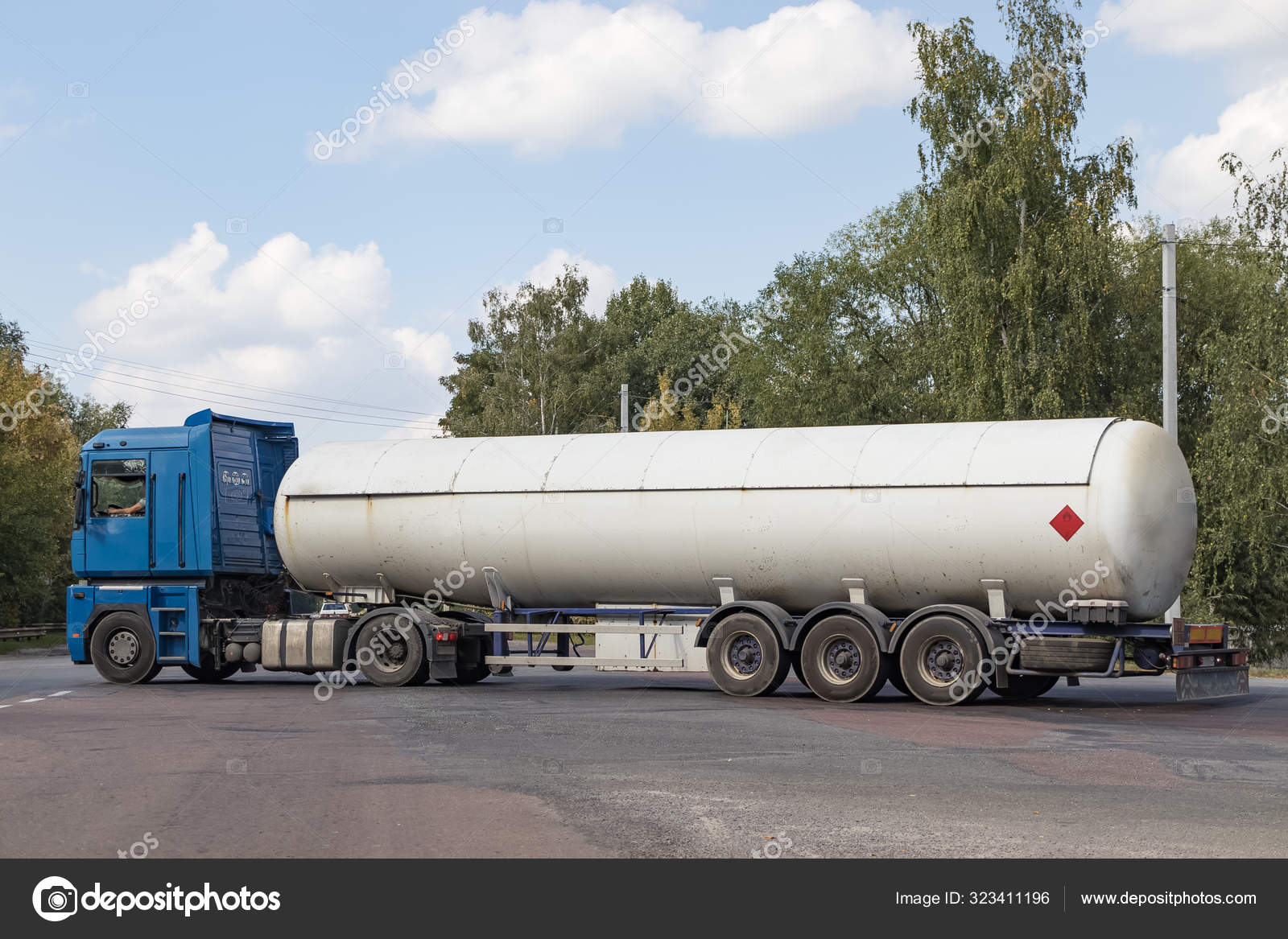 A gas tanker on a city highway Stock Photo by ©insTar 323411196