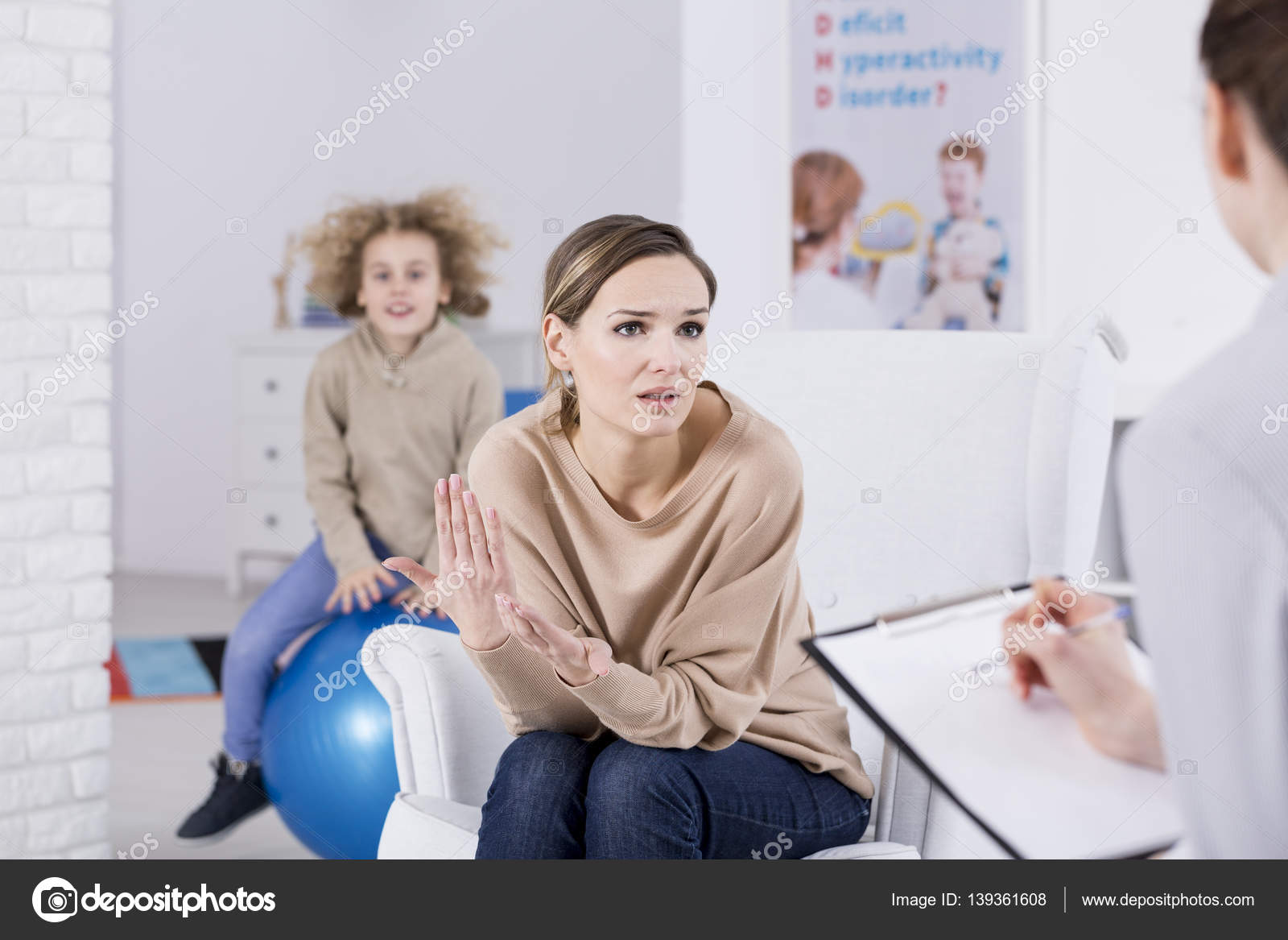 Mother helping her ADHD child Stock Photo by ©photographee.eu 139361608