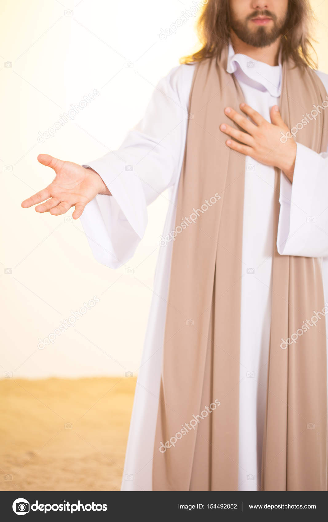 Jesus standing on sand Stock Photo by ©photographee.eu 154492052