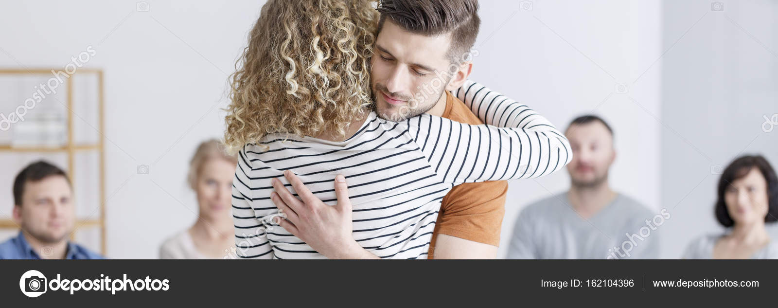 Couple hugging during therapy Stock Photo by ©photographee.eu 162104396