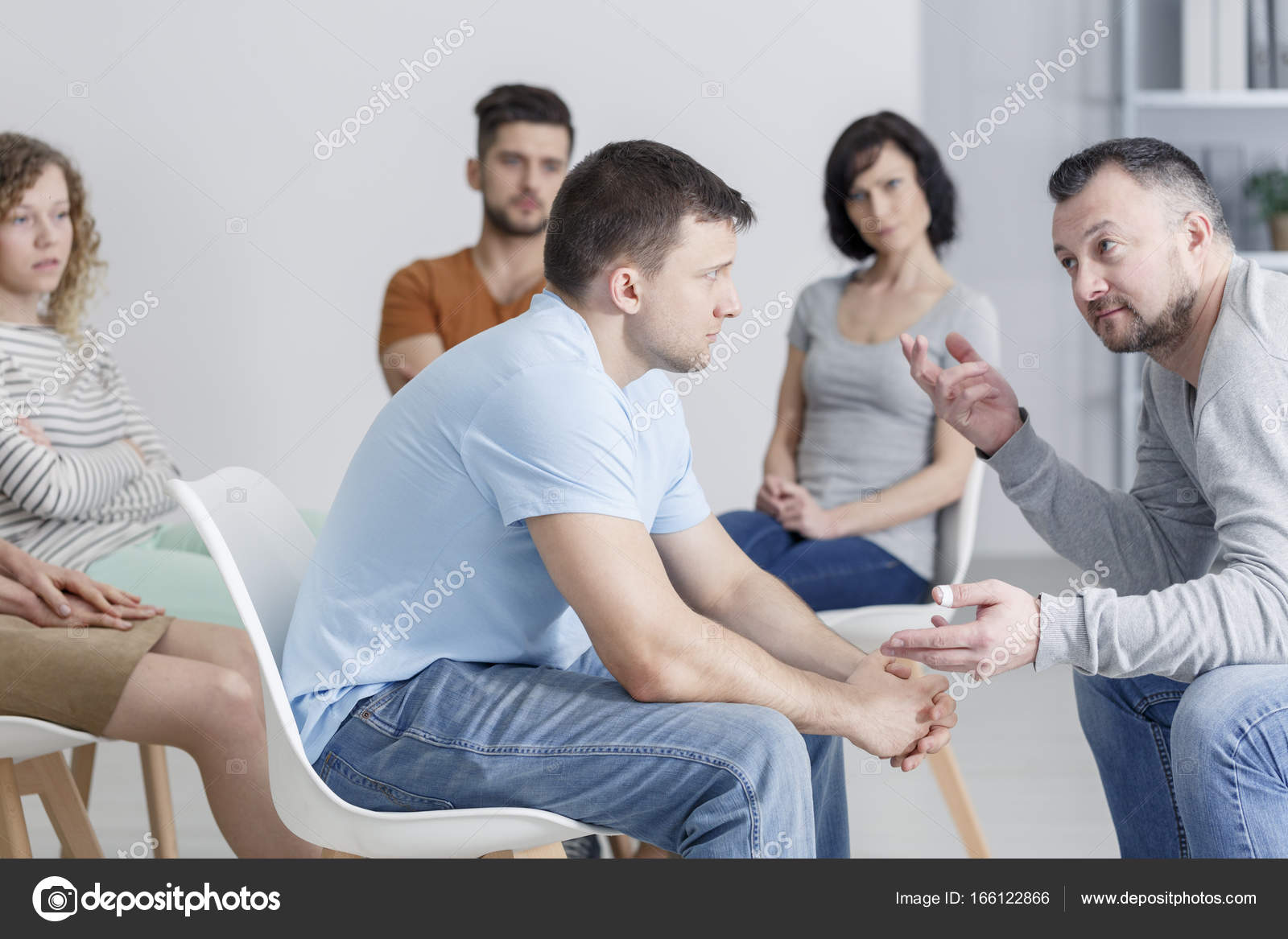 Sad man listening to therapist — Stock Photo © photographee.eu #166122866