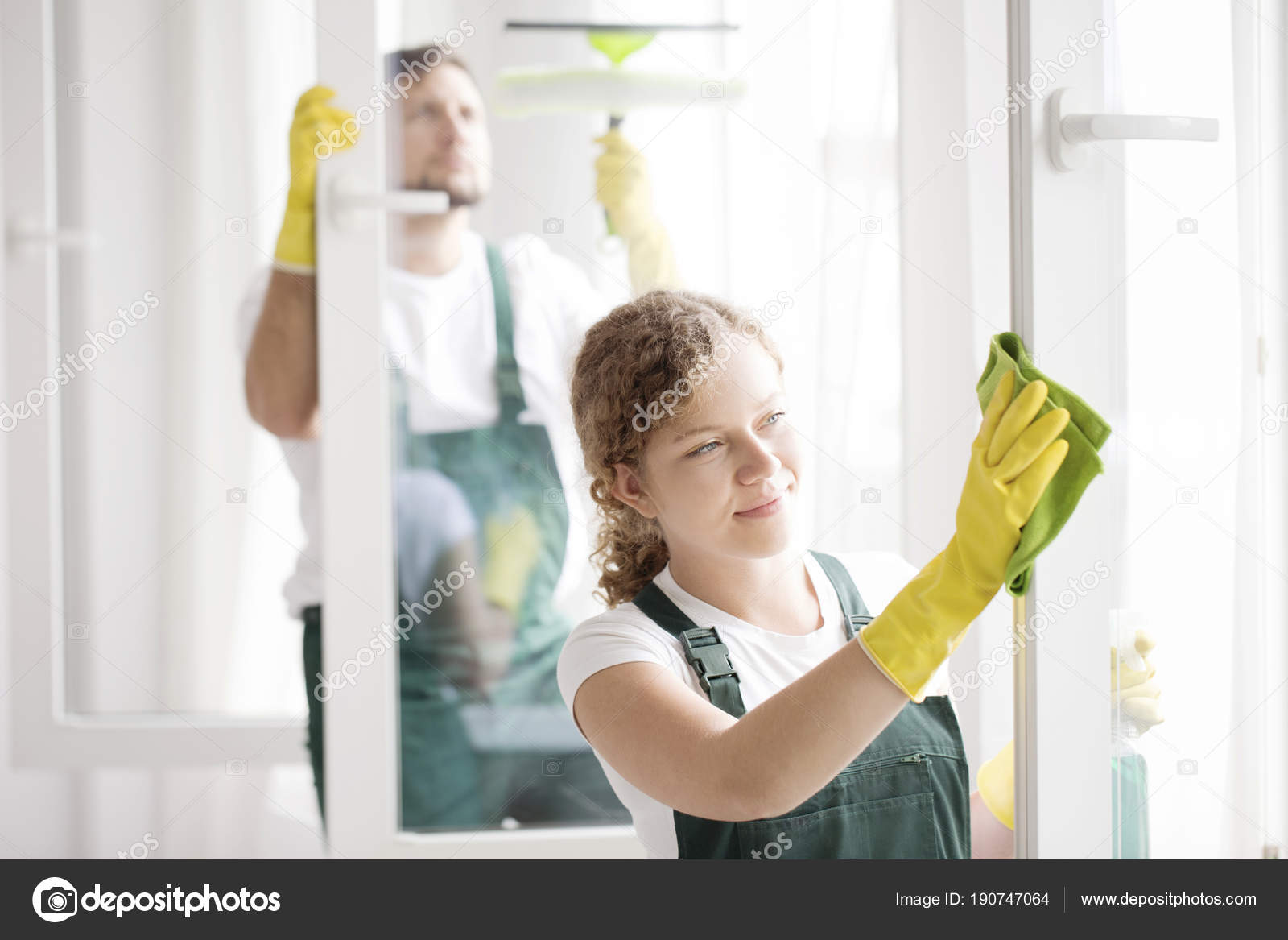 People cleaning windows Stock Photo by ©photographee.eu 190747064