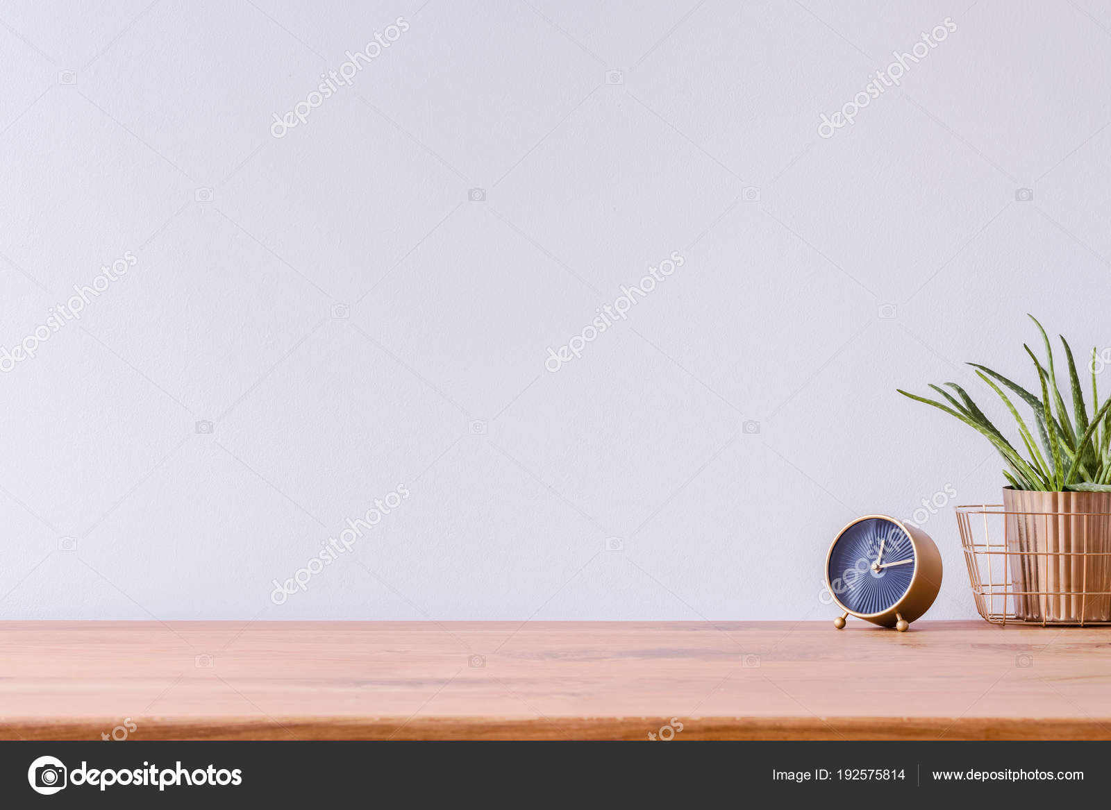 Wooden desk and empty wall Stock Photo by ©photographee.eu 192575814