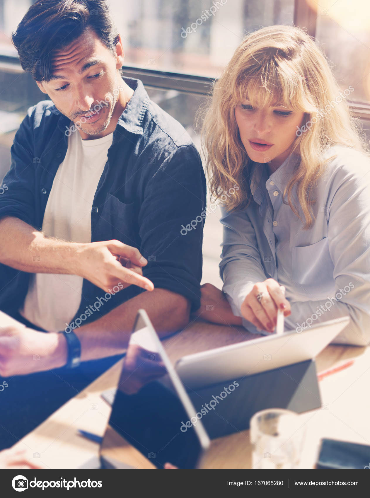 People working with startup project. Stock Photo by ©kantver 167065280