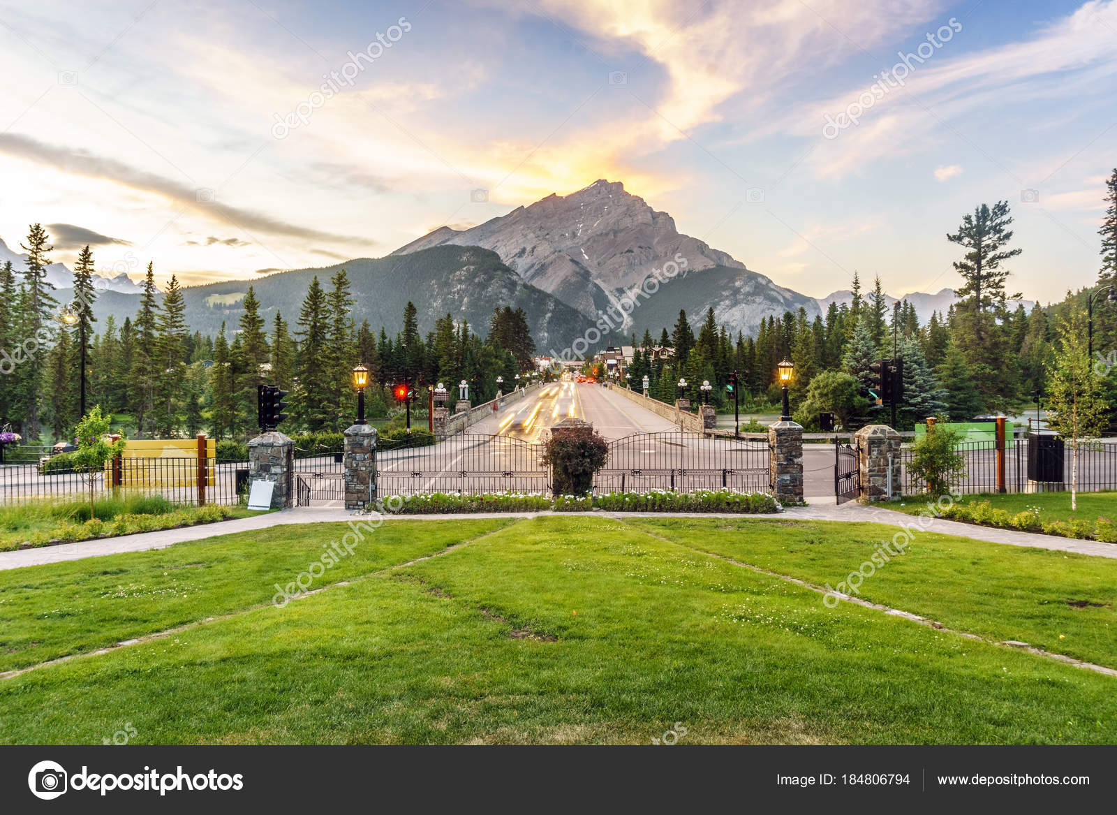 Main street in Banff with Cascade Mountain towering over town, Alberta ...