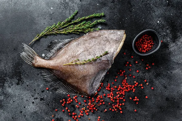 Raw fresh whole John Dory fish with spices and herbs for cooking. Black ...