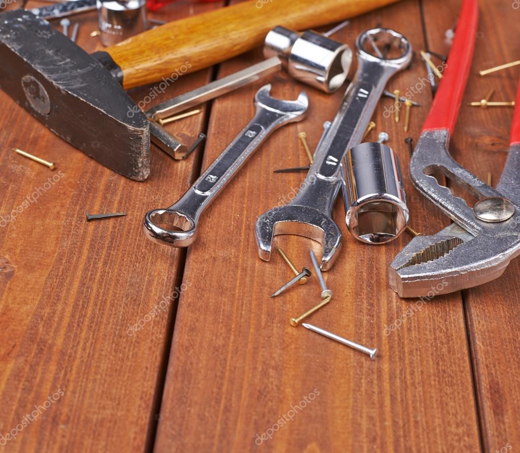 Set of different work tools on wooden surface — Stock Photo © exopixel ...