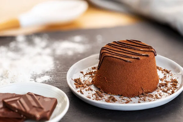 Chocolate Moelleux cake or molten cake in a small grey plate filled ...