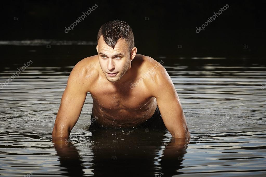 Champion kickboxer exercising in water Stock Photo by ©Couperfield ...