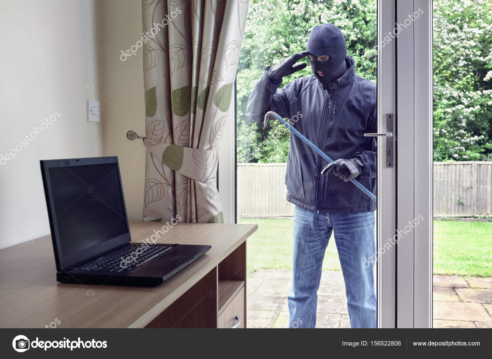 Thief looking through patio doors Stock Photo by ©BrianAJackson 156522806