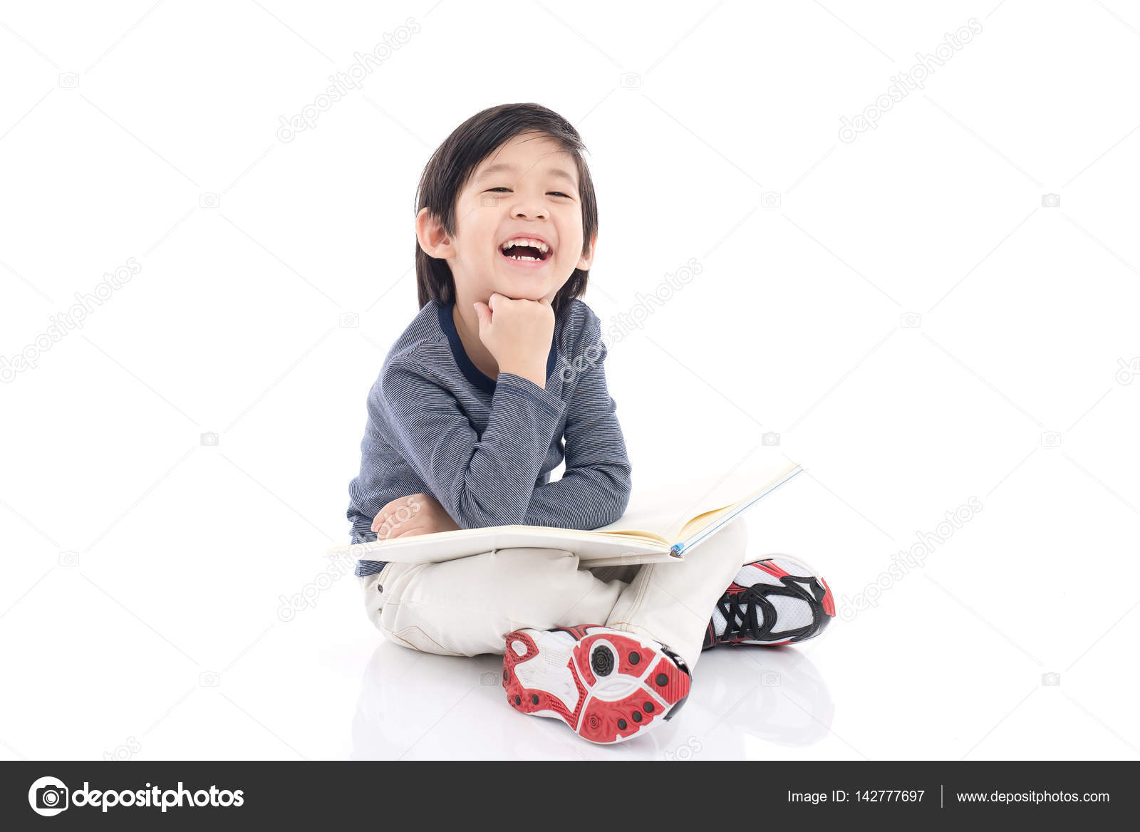 Cute asian boy reading a book on white background isolated Stock Photo ...