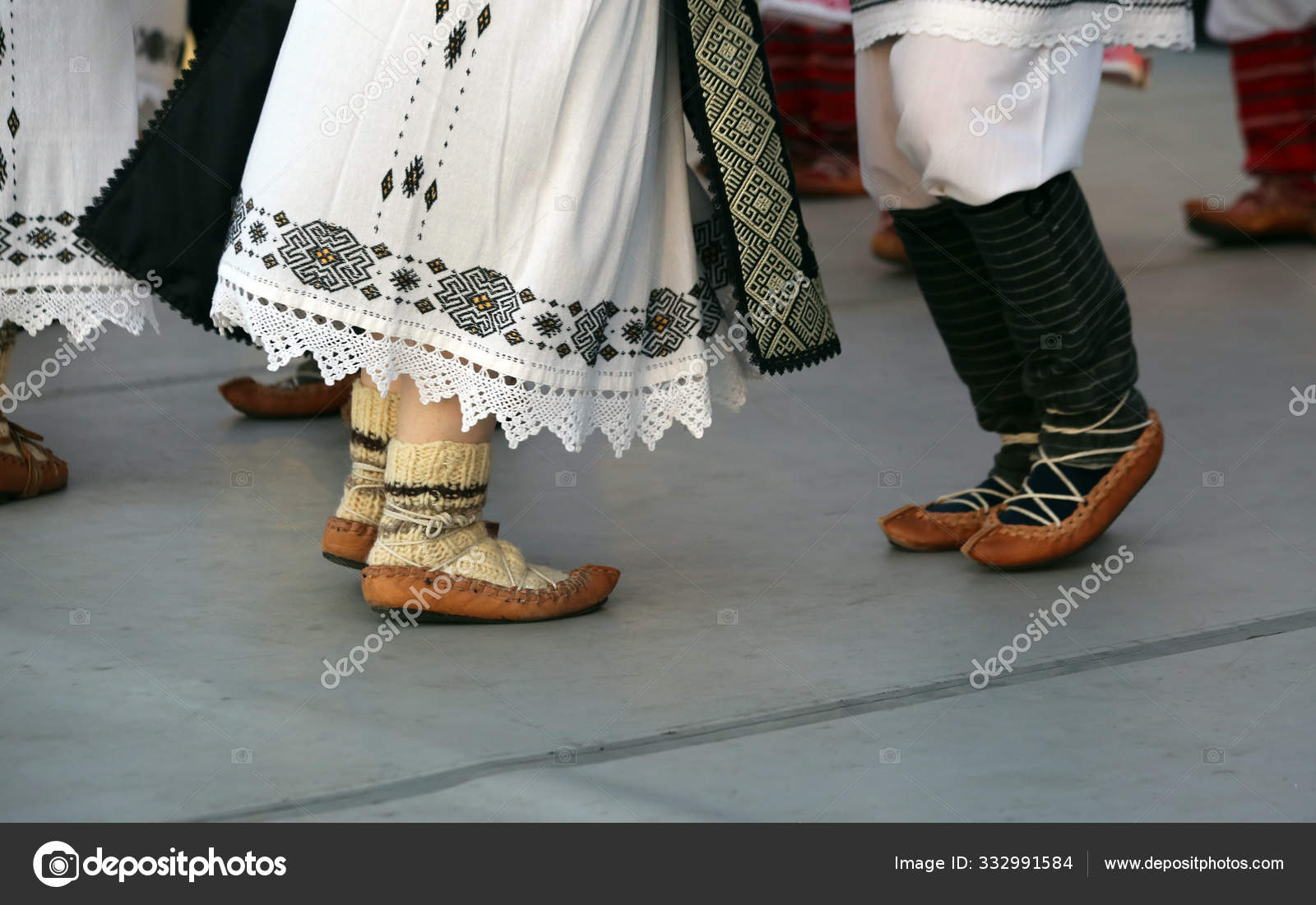 Dancers feet in a traditional Romanian dance wearing traditional ...