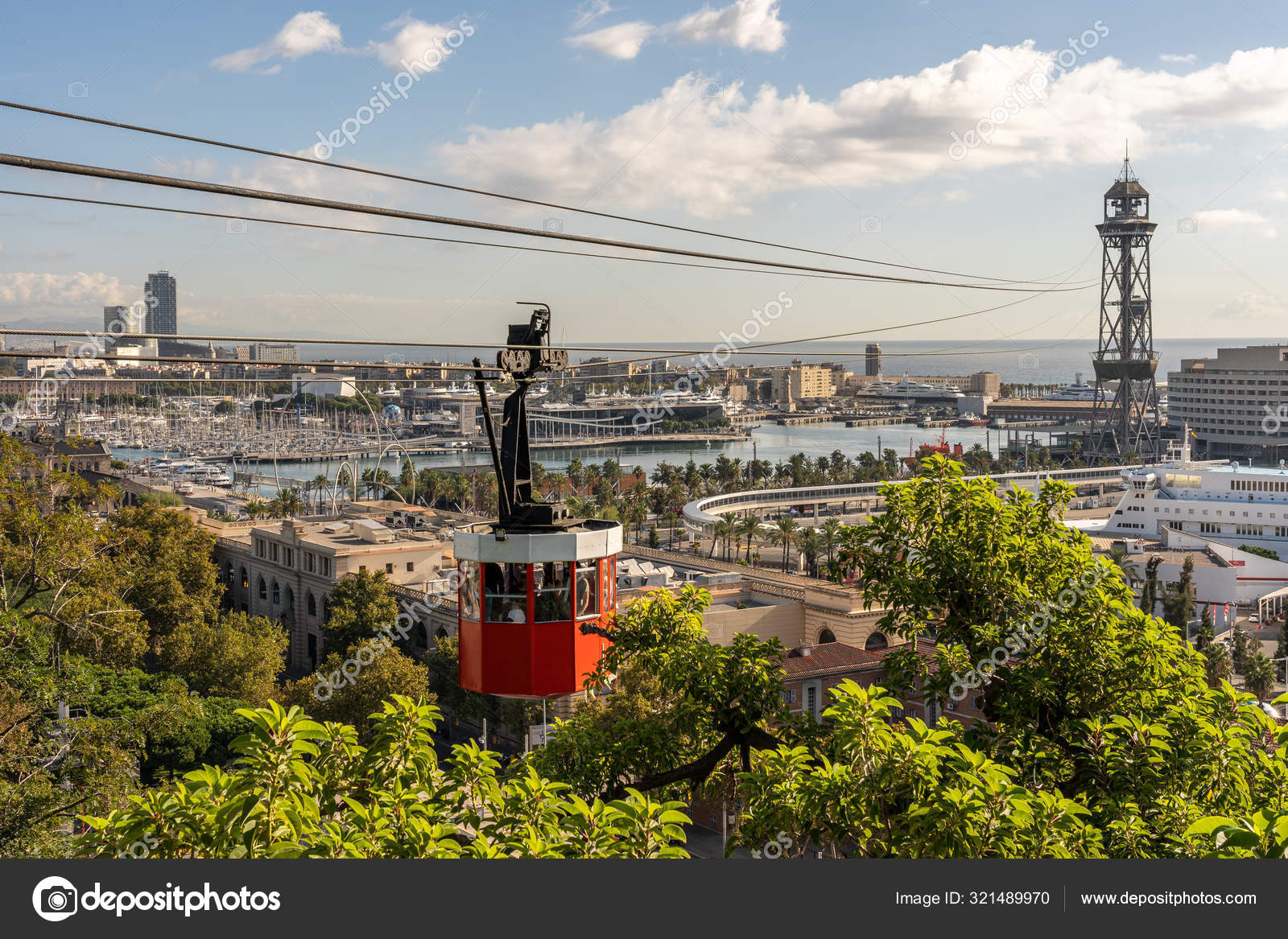 Historic red cable car cabin with harbor and panorama of Barcelo ...