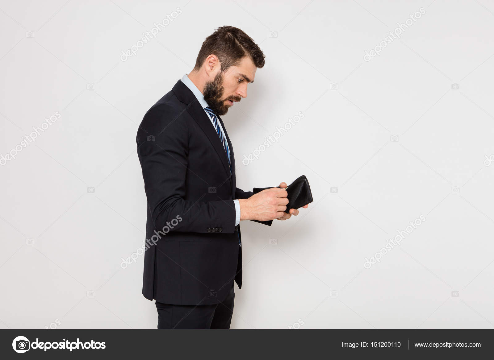 Elegant man checking his wallet on white background Stock Photo by ...
