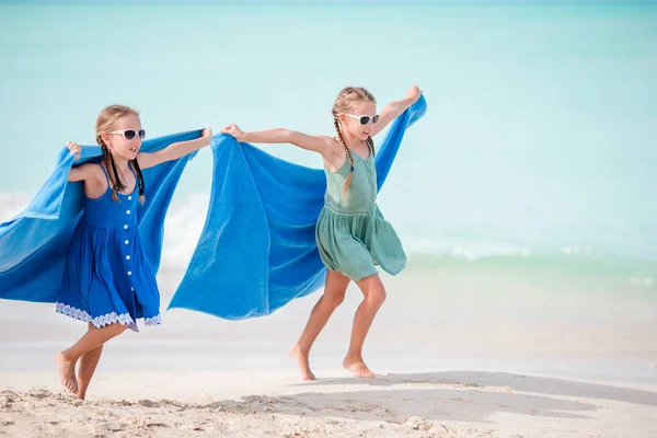 Little girls with butterfly wings have fun beach summer vacation ...