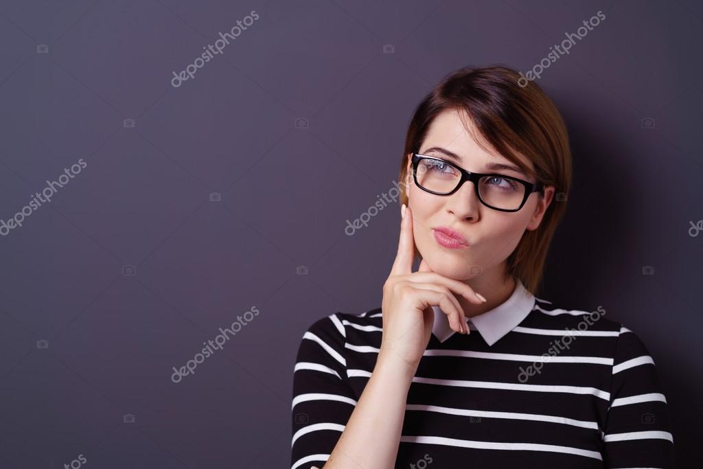 Thinking woman with fingers on chin — Stock Photo © racorn #125462640