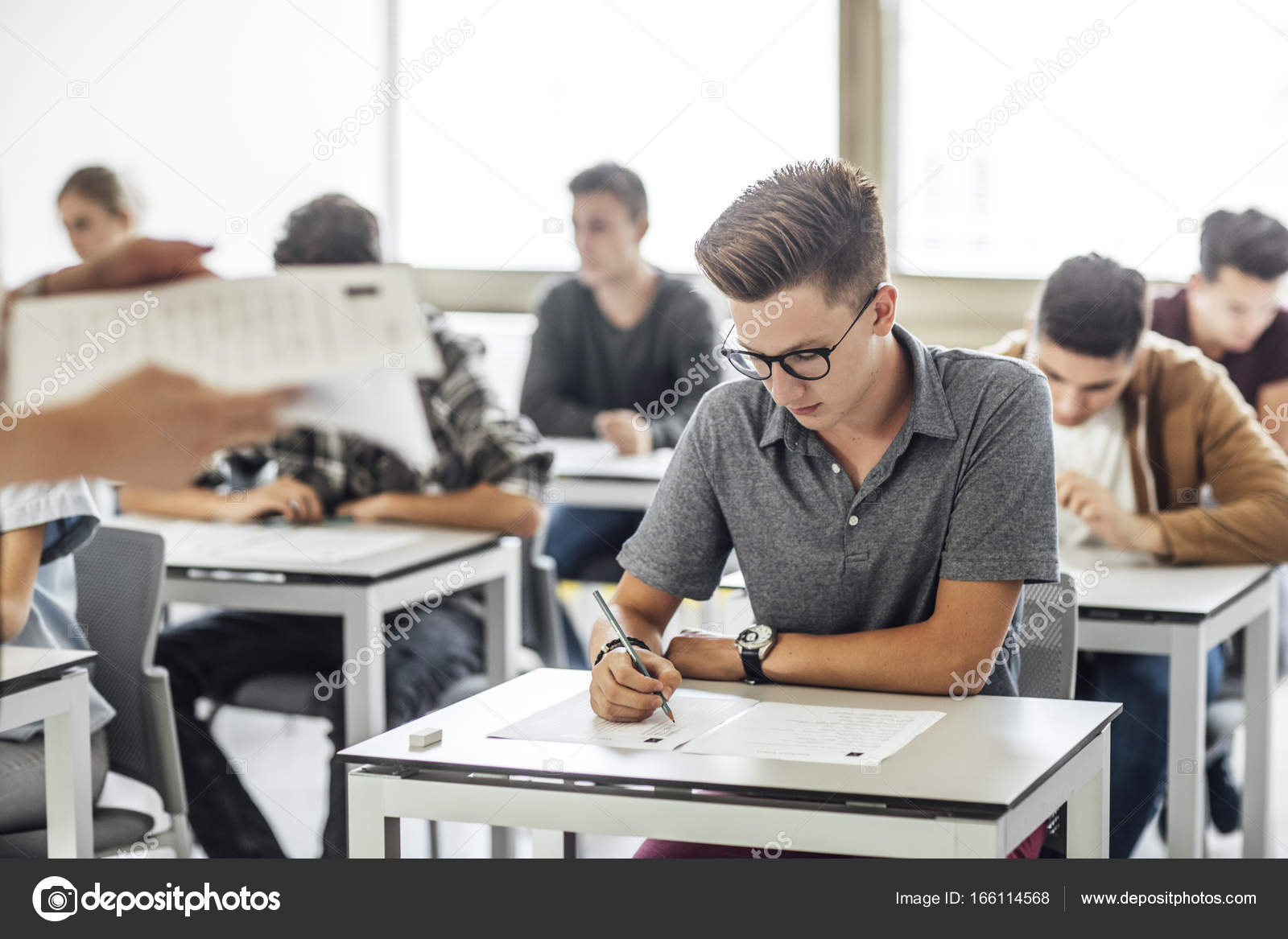 Students Doing Exam — Stock Photo © luminastock #166114568