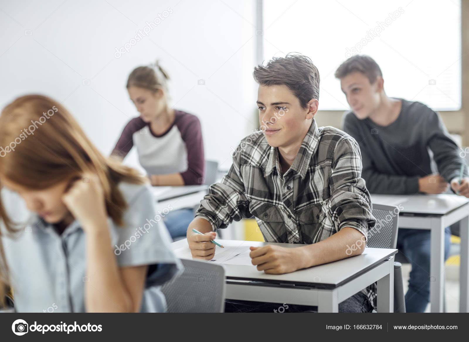 Students Doing Exam — Stock Photo © luminastock #166632784