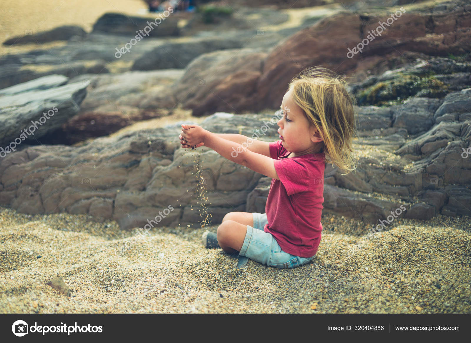 Little Toddler Playing Pebbles Beach — Stock Photo © lofilolo #320404886