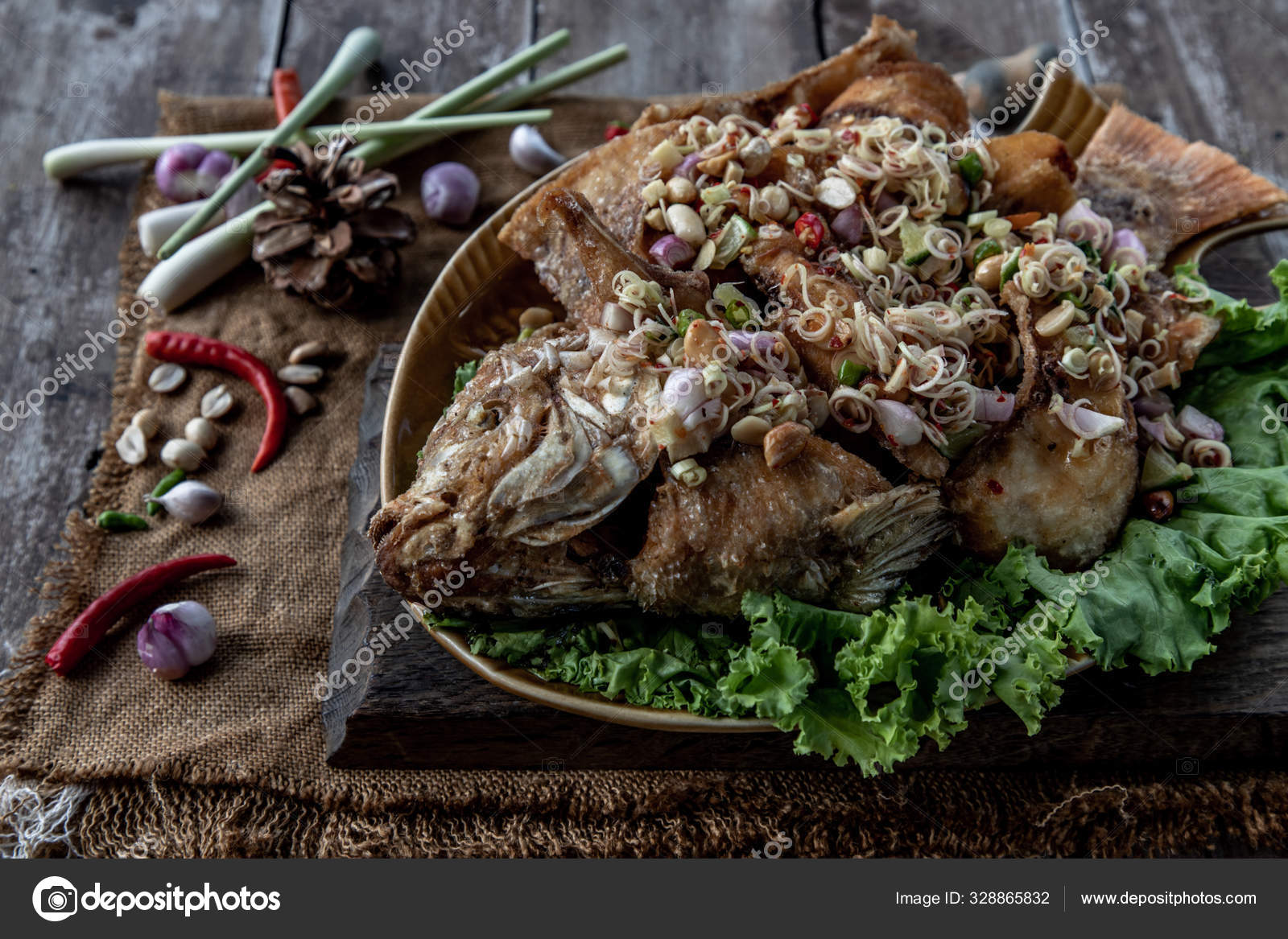 Deep fried whole Tubtim fish with spicy lemongrass salad, Food f Stock ...