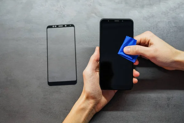 replacement of broken glass with a new one. Broken smartphone display ...