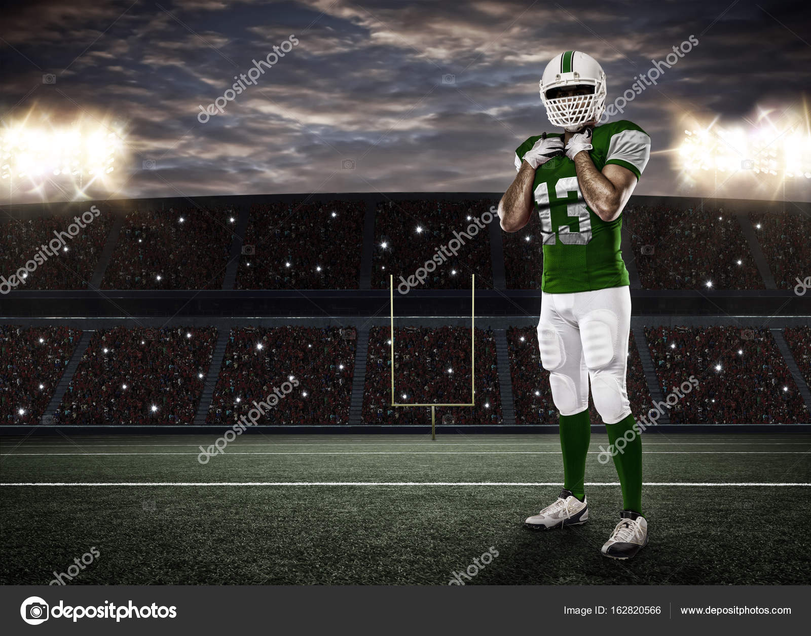 Football Player with a green uniform Stock Photo by ©betochagas 162820566