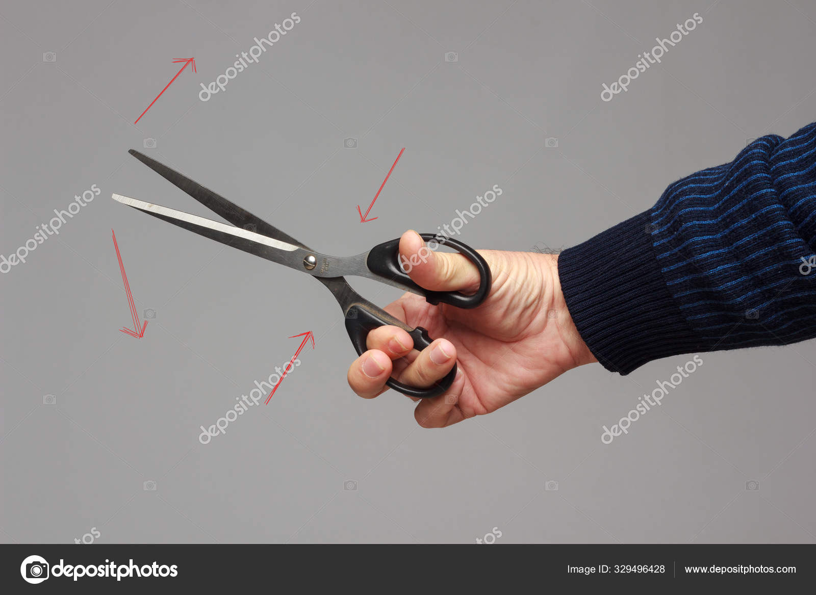 Scissors in a person's hand — Stock Photo © jorgebotella #329496428
