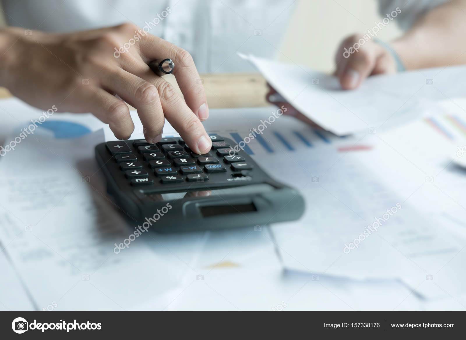 Man calculate domestic bills at home. Businessman using calculat ...