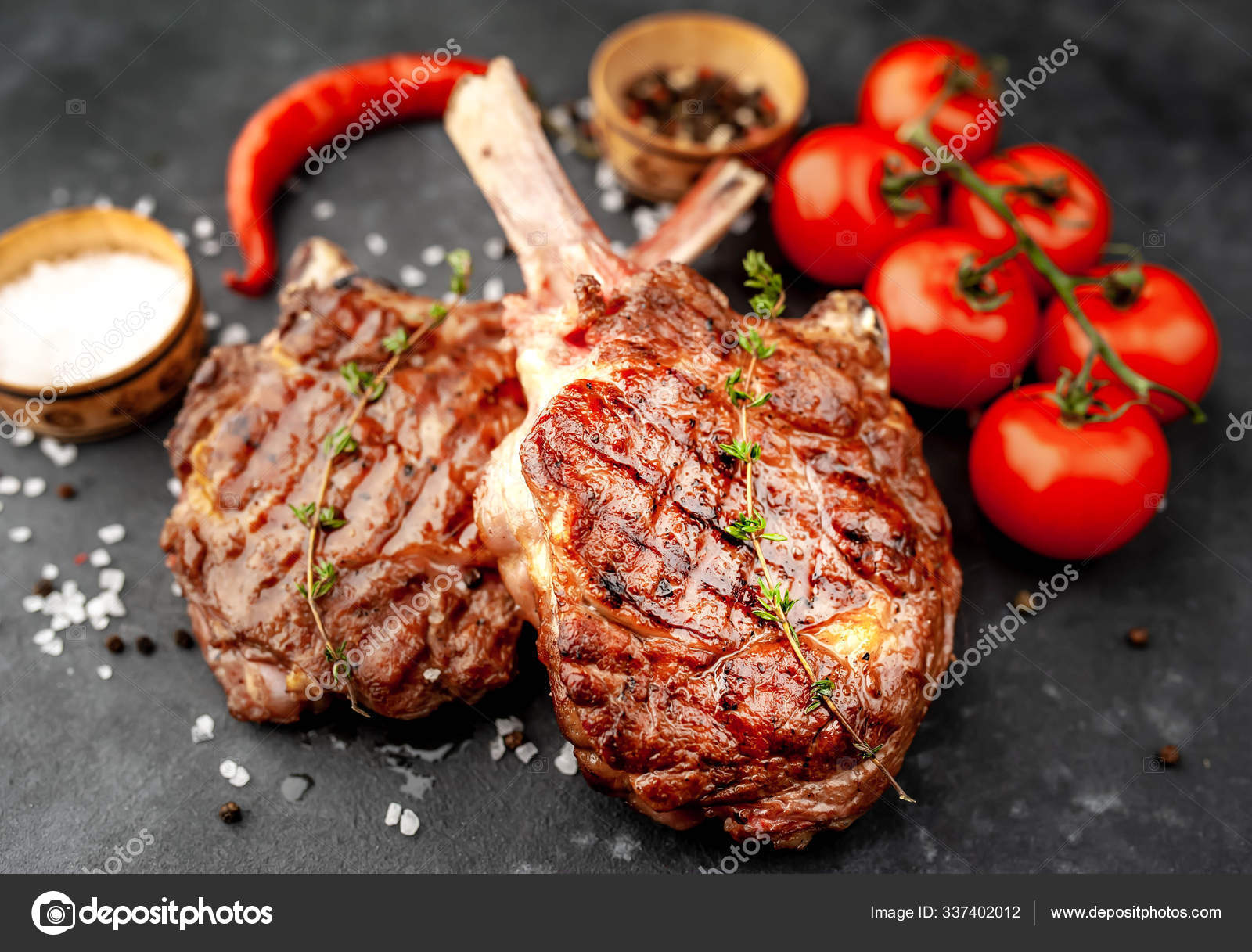 Grilled Beef Steaks Tomahawk Tomatoes Red Pepper Stone Background ...