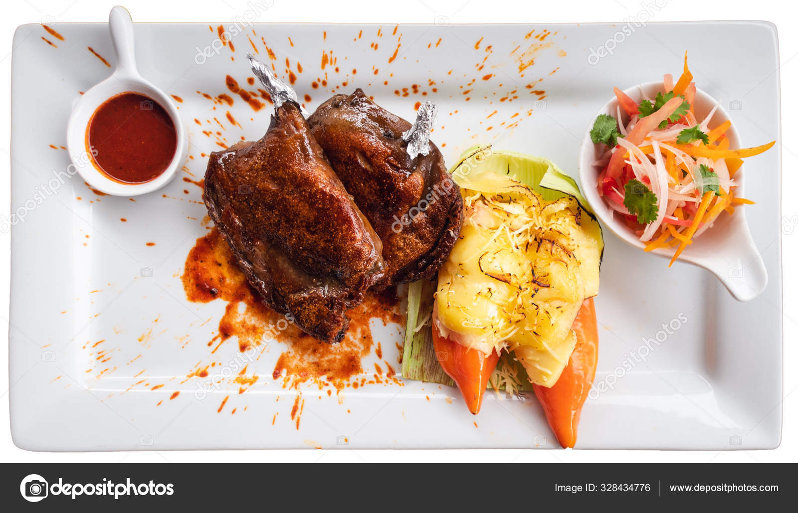 Crispy cuy (Guinea Pig) over a Peruvian chilli sauce, native peppers ...