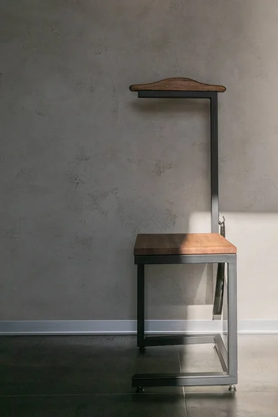 Stylish designer high chair-hanger stand in the hallway in room filled ...