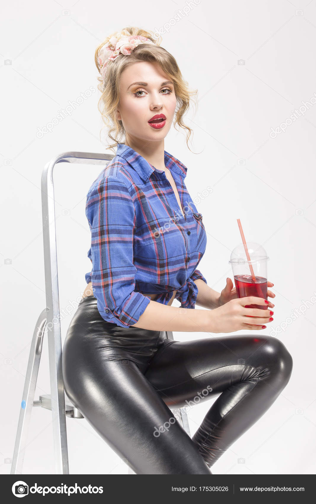Happy Smiling Caucasian Blond Woman In Checked Shirt And Latex Pants