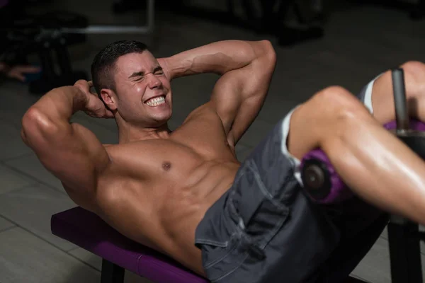 Healthy Man Doing Sit-Ups On Bench - Stock Image - Everypixel