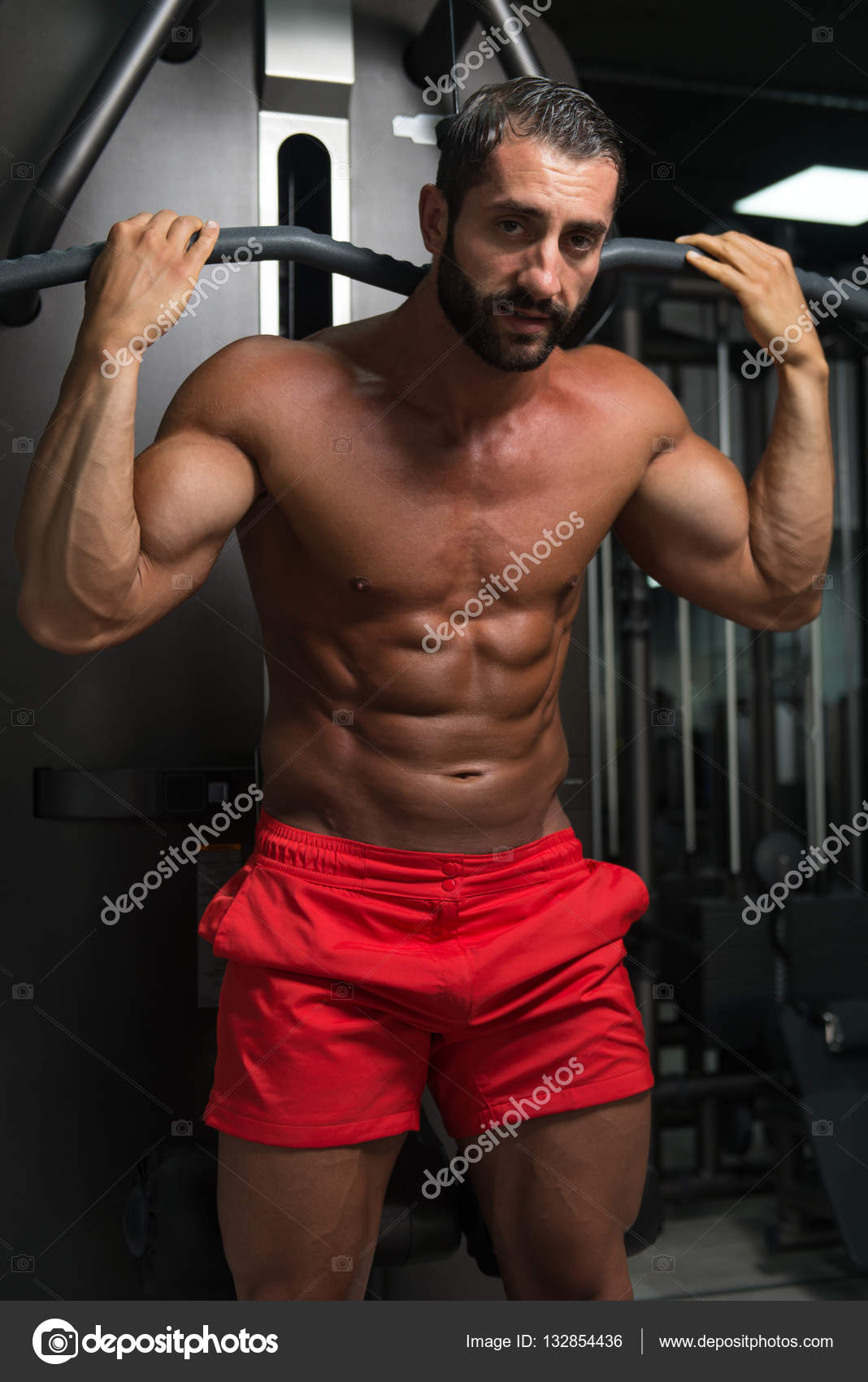 Muscular Man Doing Heavy Weight Exercise For Back Stock Photo by ©ibrak ...