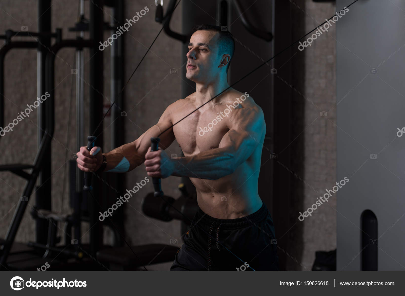 Man Doing Exercise For Biceps On Cable Machine — Stock Photo © ibrak ...