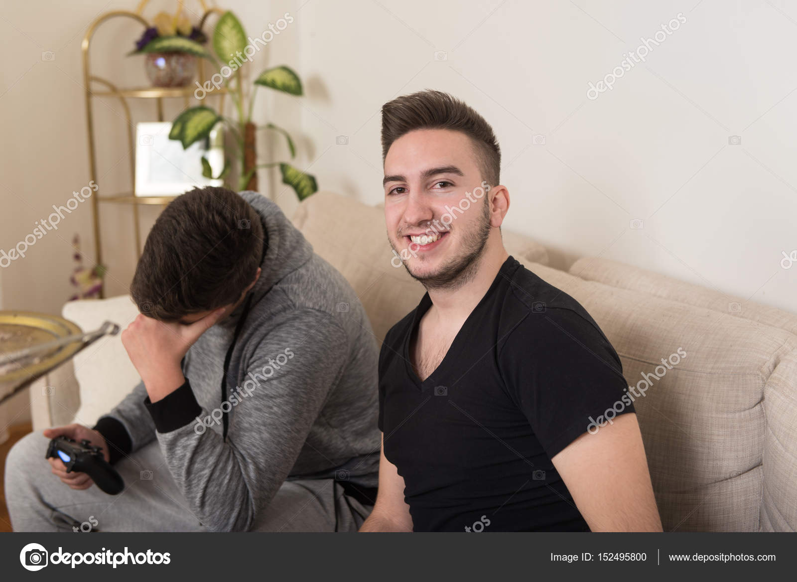 Two Friends Playing Video Games — Stock Photo © ibrak #152495800