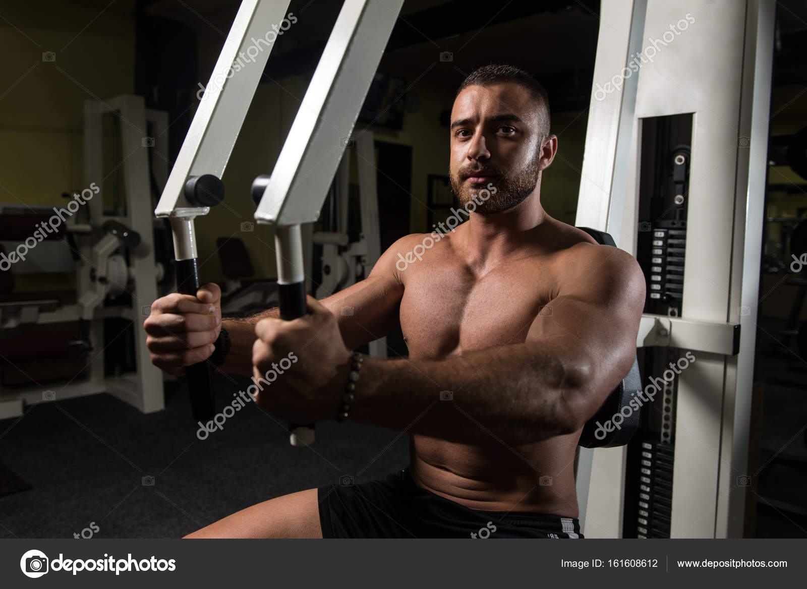 Bodybuilder Exercising Chest On Machine — Stock Photo © ibrak #161608612