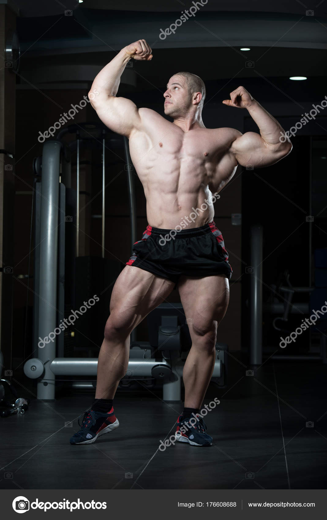 Muscular Man Flexing Muscles In Gym Stock Photo Image Of Fitness