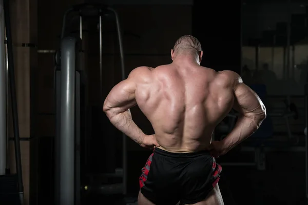 Bodybuilder Flexing Muscles - Stock Image - Everypixel