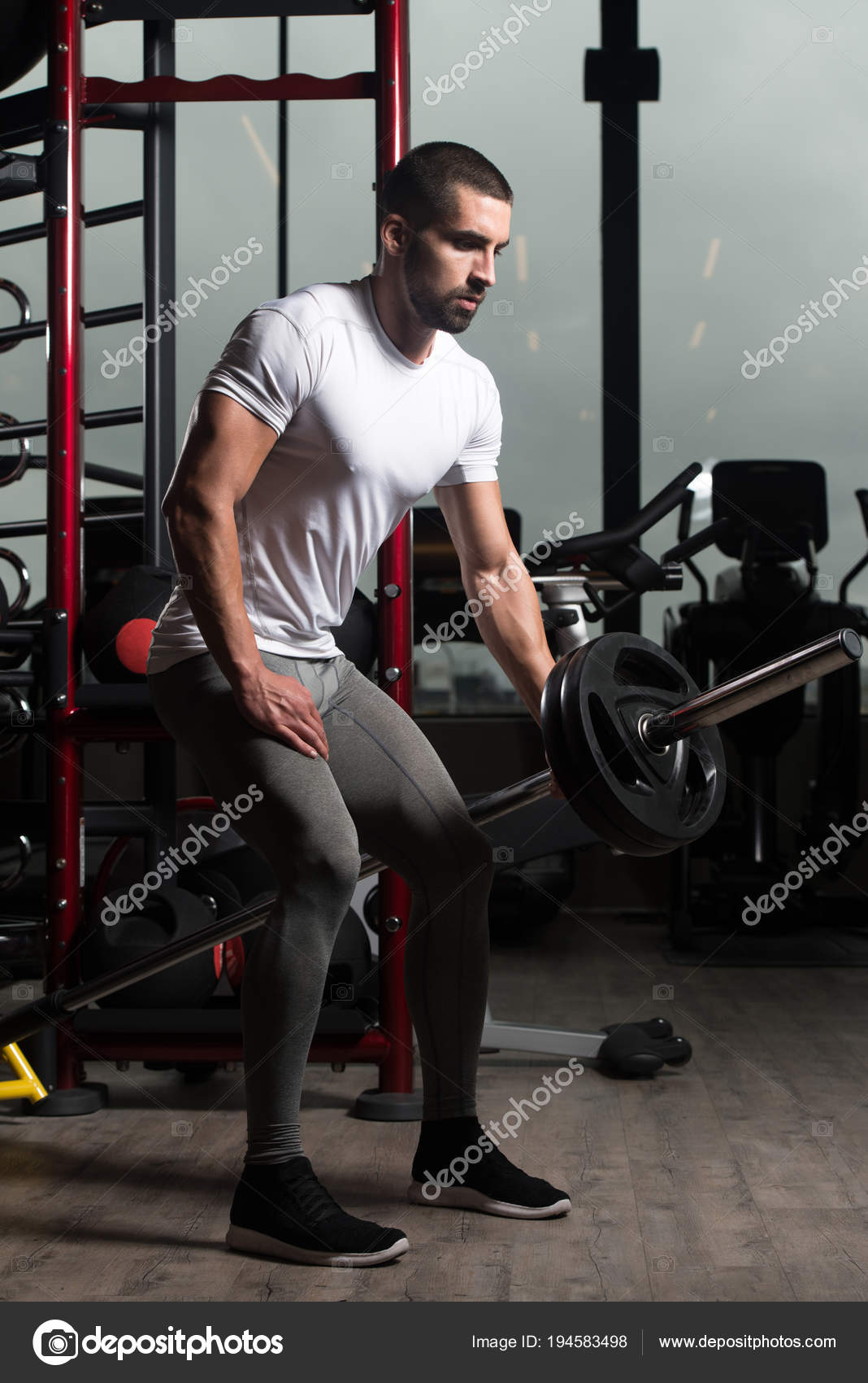 Muscular Man Exercising Back With Barbell — Stock Photo © ibrak #194583498