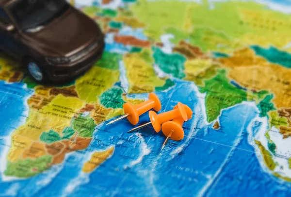 travel destination points on map indicated with colorful thumbtacks and ...