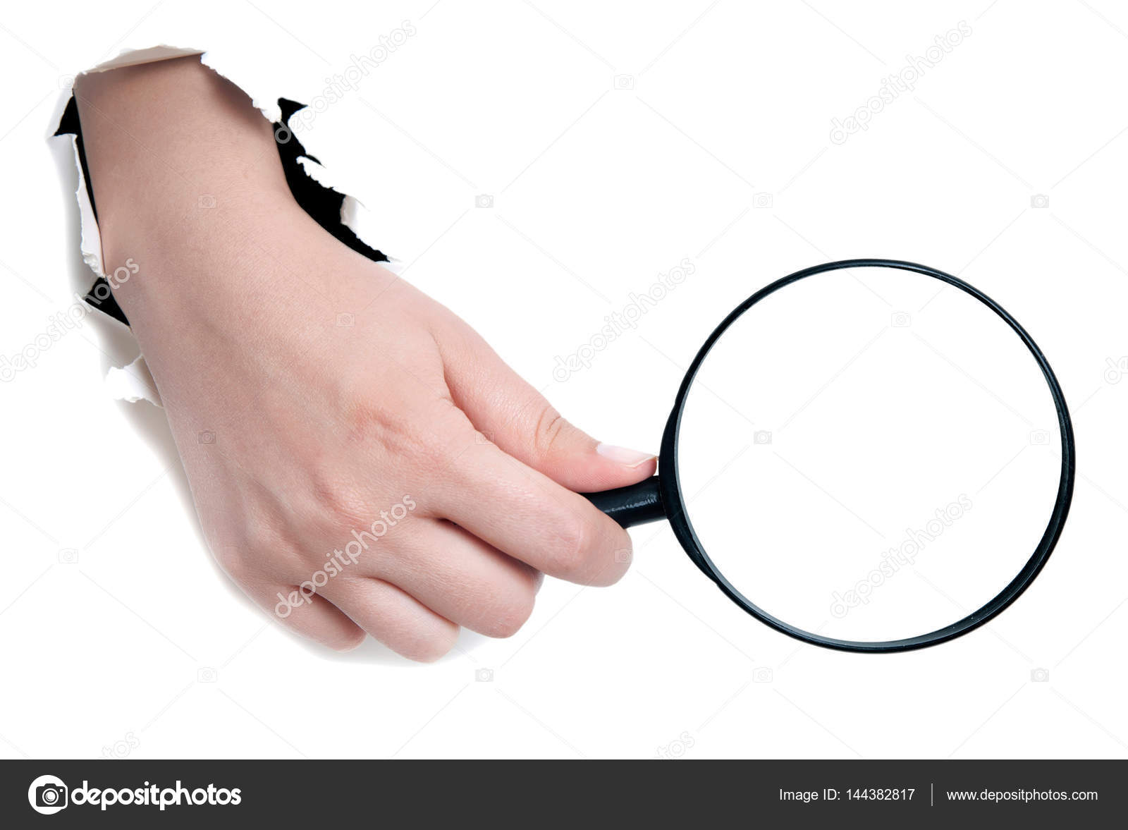 Female hand holding the magnifying glass isolated on white backg ...